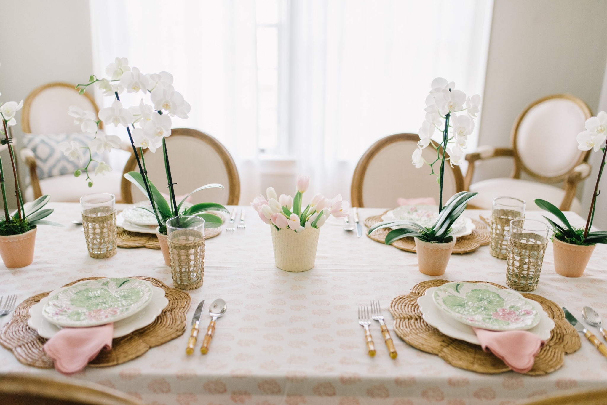 Pink and green feminine tablescape orchid tulips publix